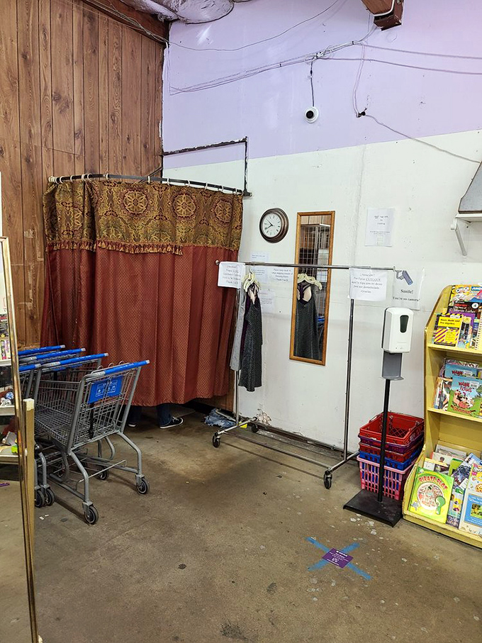 The no-frills dressing area with its ornate curtain&mdash;where vintage fashion dreams are confirmed or gently redirected to the next rack.
