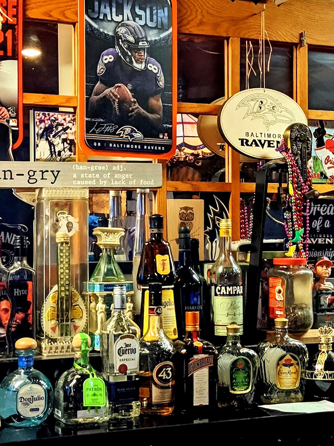 The bar's back wall&mdash;a shrine to Baltimore sports and spirits&mdash;where Ravens memorabilia watches over your drinking decisions with silent approval.
