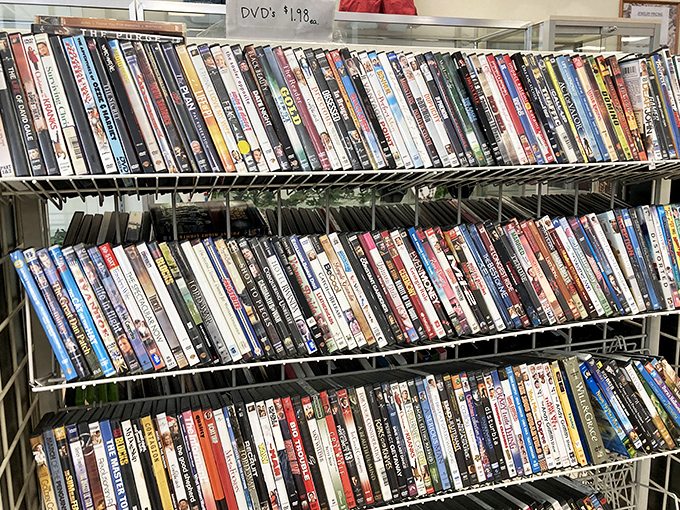 DVD shelves packed tighter than a Netflix server. Physical media paradise where forgotten films find new audiences for pocket change.
