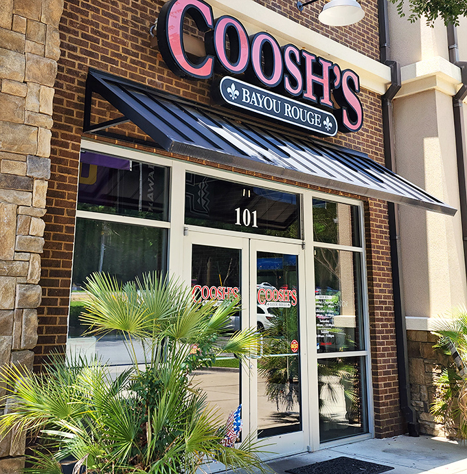 Palm fronds frame the entrance like nature's welcome committee, a tropical touch that bridges Florida sunshine with Louisiana soul.