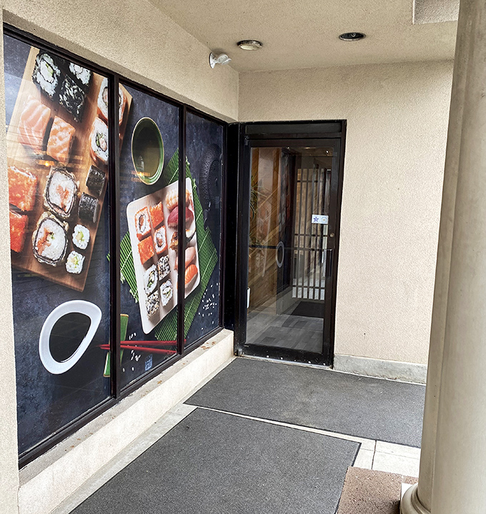 The entrance promises what awaits inside: a visual feast before the actual feast begins. Those food photos aren't lying&mdash;they're foreshadowing.