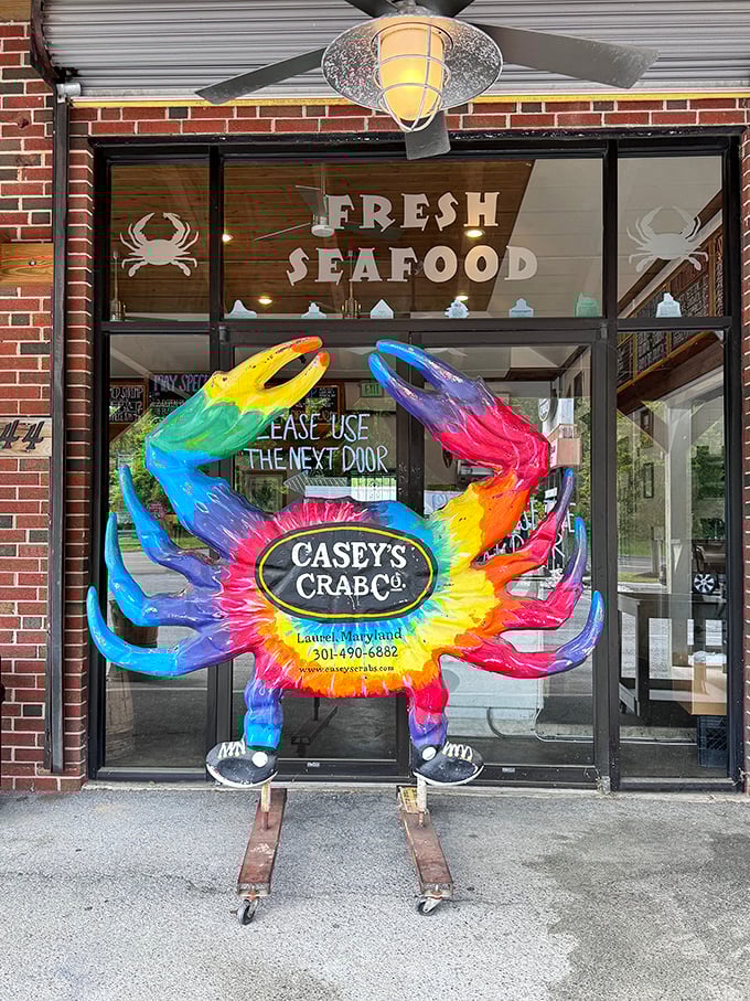 The rainbow-colored crab mascot guards the entrance like a psychedelic sentinel of seafood. This tie-dyed crustacean promises a flavor trip worth taking.