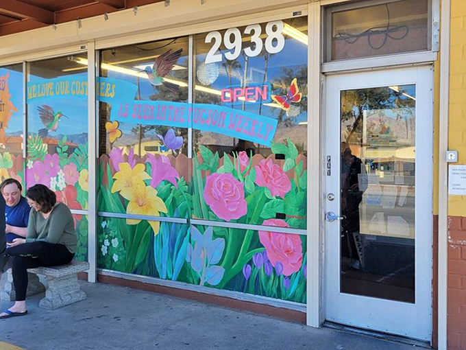 Window art that rivals any gallery installation. These vibrant flowers welcome hungry patrons like old friends returning to their favorite breakfast spot.
