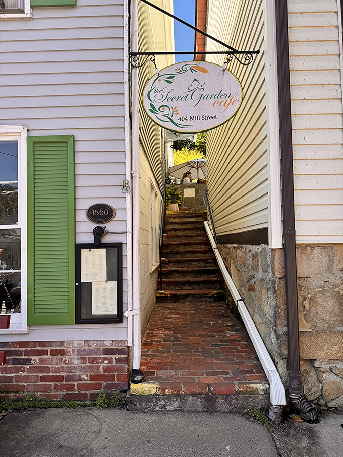 The entrance reveals itself like the namesake "secret garden"&mdash;a hidden stairway promising culinary adventures just steps away.