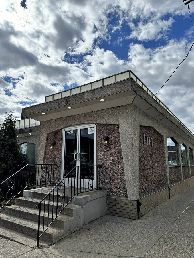 Mid-century modern meets neighborhood fixture. The stone facade and wrought iron railings welcome hungry visitors day and night.