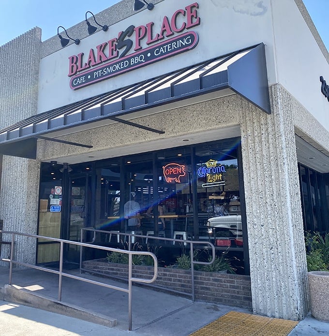 The entrance to Blake's Place—where diet plans go to die and stretchy pants come to thrive. That neon "OPEN" sign might as well say "SURRENDER."