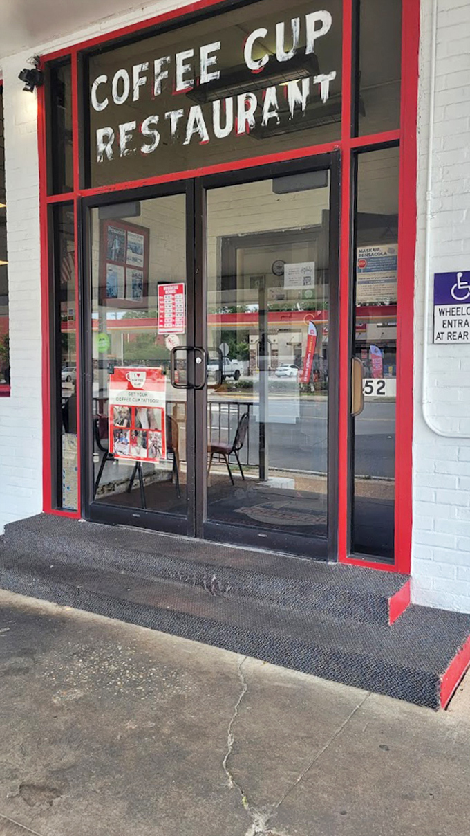 The entrance promises simple pleasures within. No fancy frills, just the honest invitation of "COFFEE CUP RESTAURANT" in letters as straightforward as the food inside.