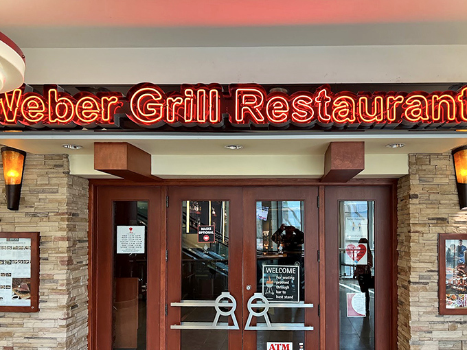 An entrance that feels like the gateway to grilling paradise, complete with door handles shaped like Weber's iconic kettle lid holders.