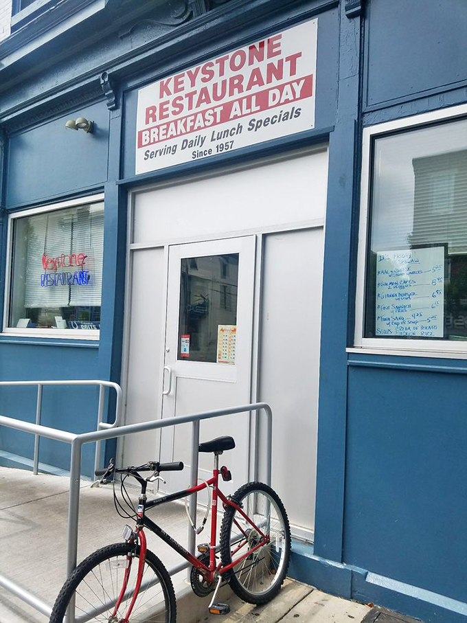 The entrance with its iconic sign and a loyal customer's bike parked outside. Some people will pedal miles for food this good.