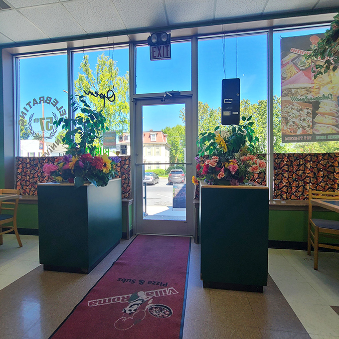 The entryway's floral arrangements add unexpected elegance, like finding out your reliable old friend secretly knows how to tango.