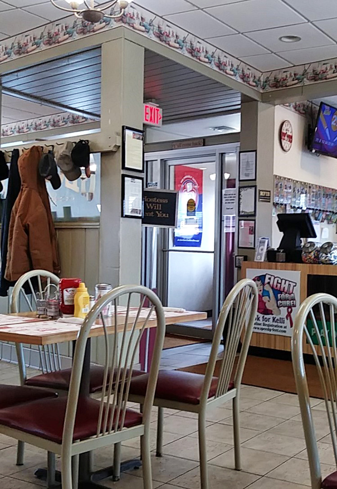 The coat rack by the exit tells the story of a place where people stay awhile, getting comfortable enough to shed layers.