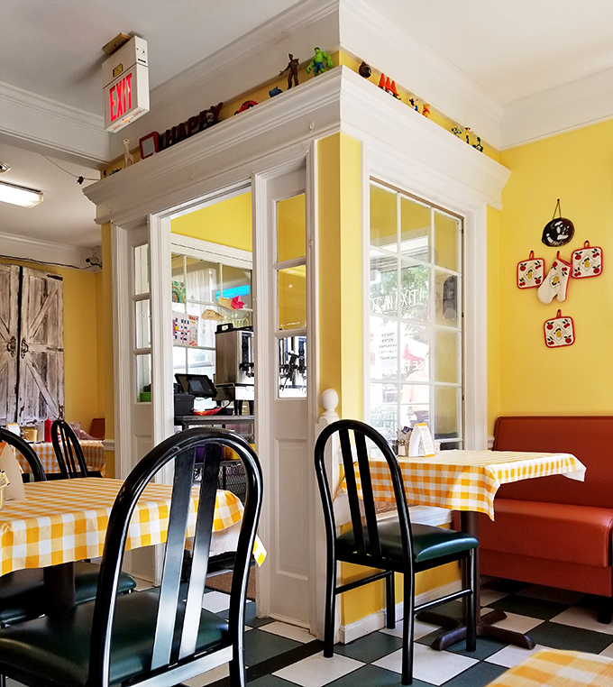 A glimpse of the interior architecture reveals thoughtful design touches amid the cheerful yellow walls.