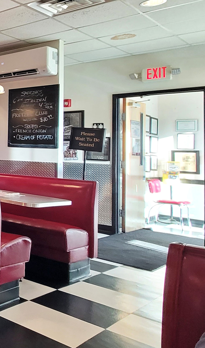 The "Please Wait To Be Seated" sign&mdash;diner code for "good things come to those who wait." Specials on the chalkboard hint at today's treasures.