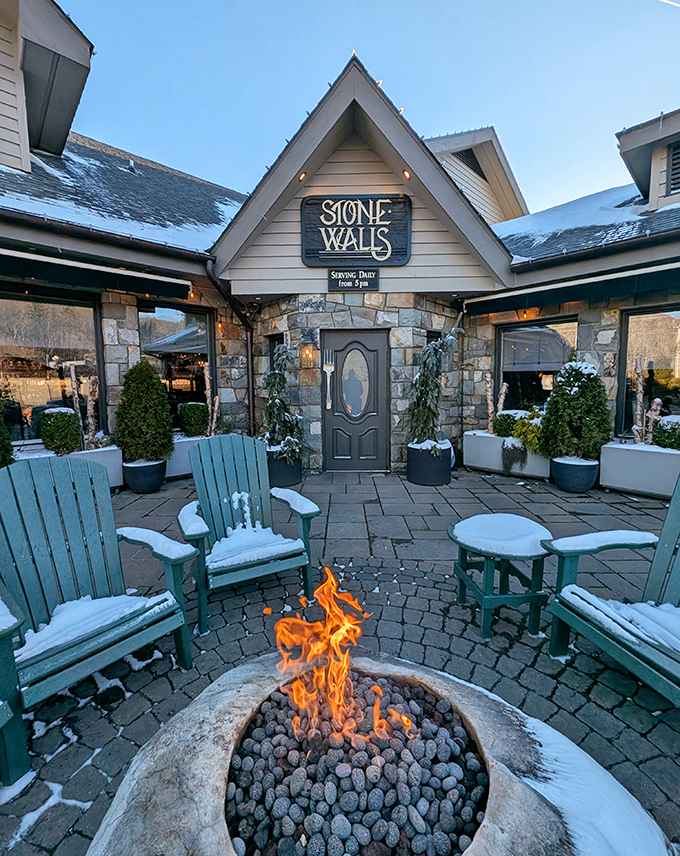 Winter transforms the entrance into a scene from a holiday movie&mdash;fire dancing against snow-dusted chairs, inviting you into the warmth.