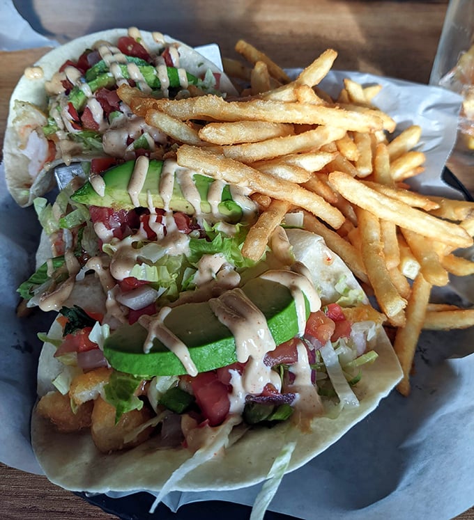 Fish tacos that deserve their own flight plan—crispy, fresh, and adorned with vibrant toppings that create a perfect harmony of textures and flavors.