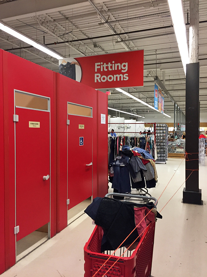 Fitting rooms standing like bright sentinels, where fashion dreams either soar or crash in the harsh reality of fluorescent lighting.