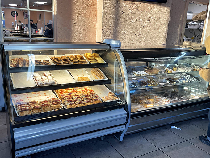 The pastry case displays an array of Cuban sweets and treats, each one a small masterpiece waiting to complete your meal.