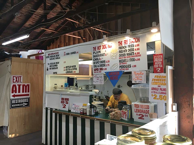 The market's food stand menu board promises simple pleasures: hot dogs, fries, and lemonade&mdash;fuel for serious treasure hunting ahead.