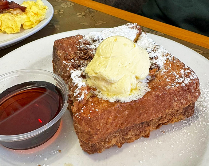 French toast that's essentially cake masquerading as breakfast, topped with ice cream because sometimes adulting means dessert at 9 AM.
