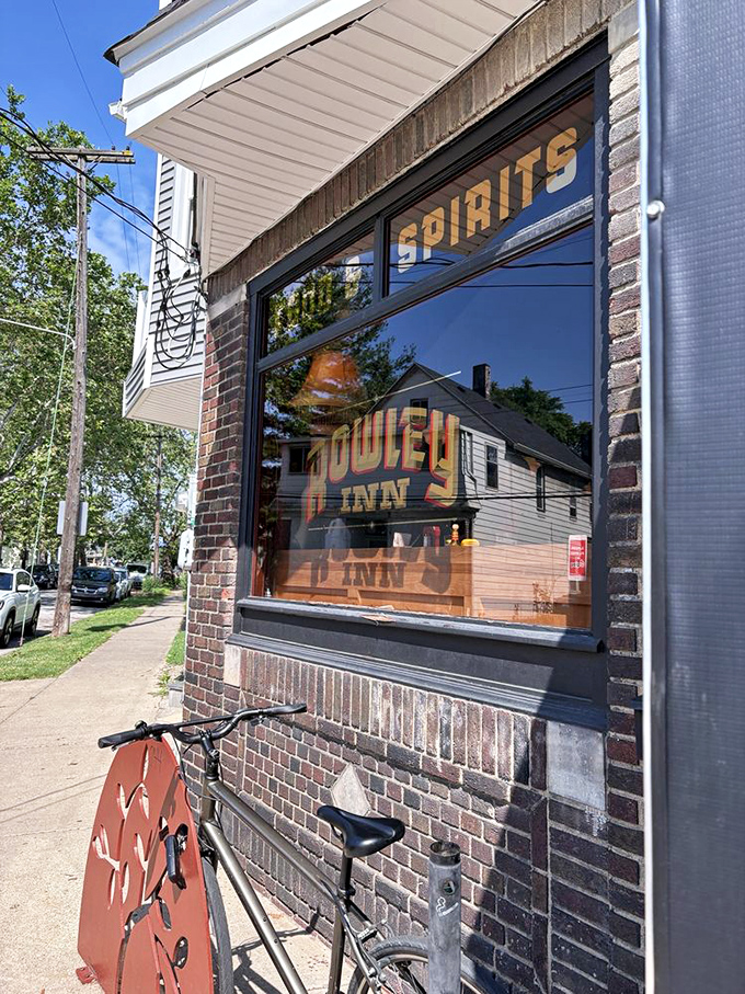 Through these windows, you can glimpse both the restaurant's warm glow and reflections of the neighborhood that's kept it thriving for generations.