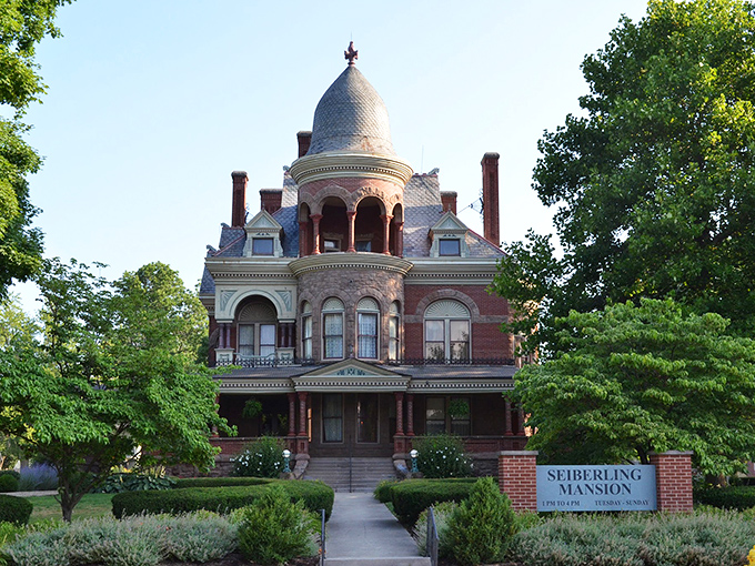 The mansion's front facade captures that magical moment when the sun highlights every architectural flourish, like nature's own spotlight.