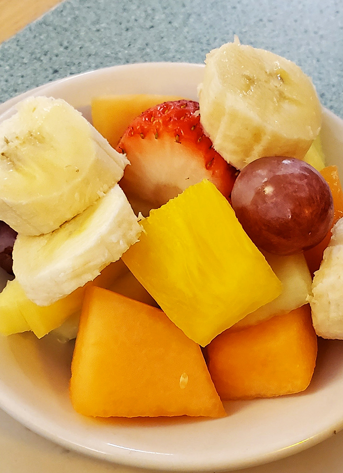 A fruit cup that actually looks like someone cared &ndash; fresh chunks of melon, banana, and berries that aren't just an afterthought.
