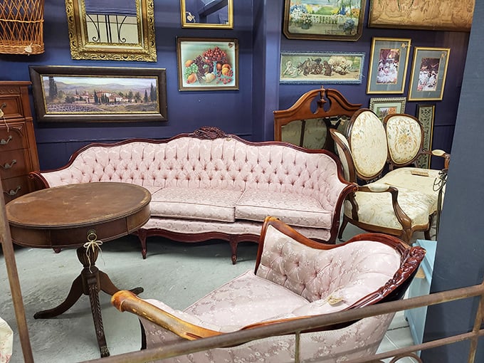 Vintage furniture vignettes create time-travel moments. This pink tufted sofa has likely witnessed everything from marriage proposals to heated Monopoly disputes.