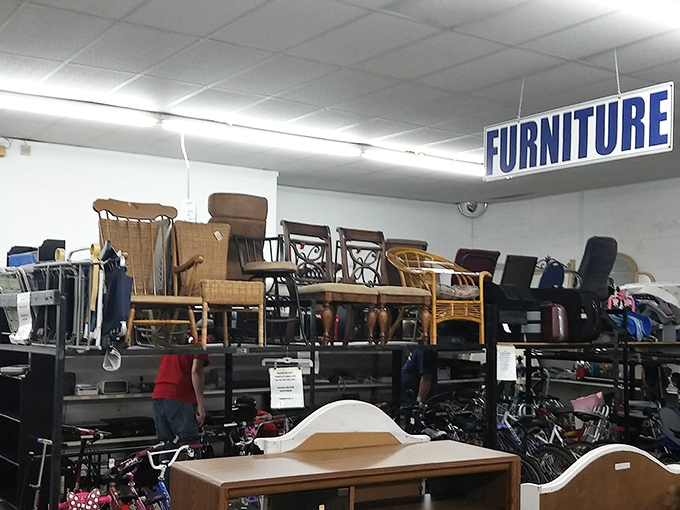 Furniture mountain! Chairs stacked upon chairs create a precarious peak of seating possibilities, each with character you can't find in big box stores.