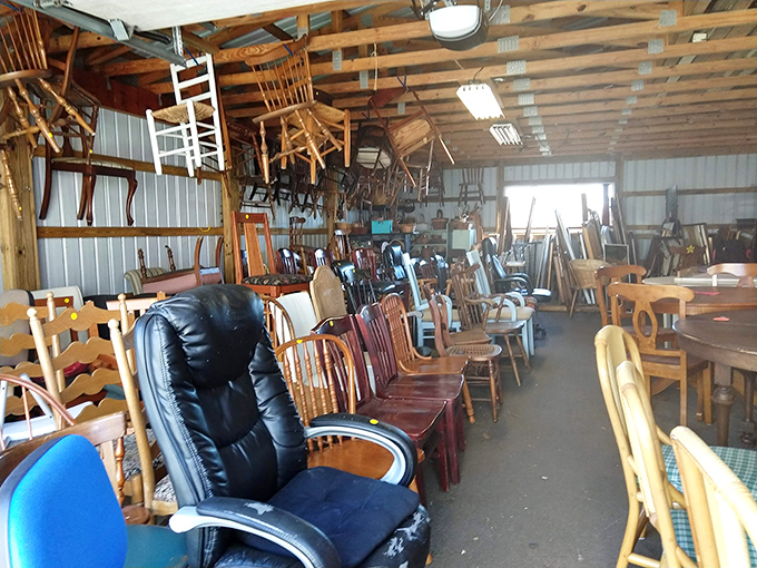 The furniture warehouse resembles a wooden chair convention, where dining sets and recliners compete for the attention of budget-conscious decorators.