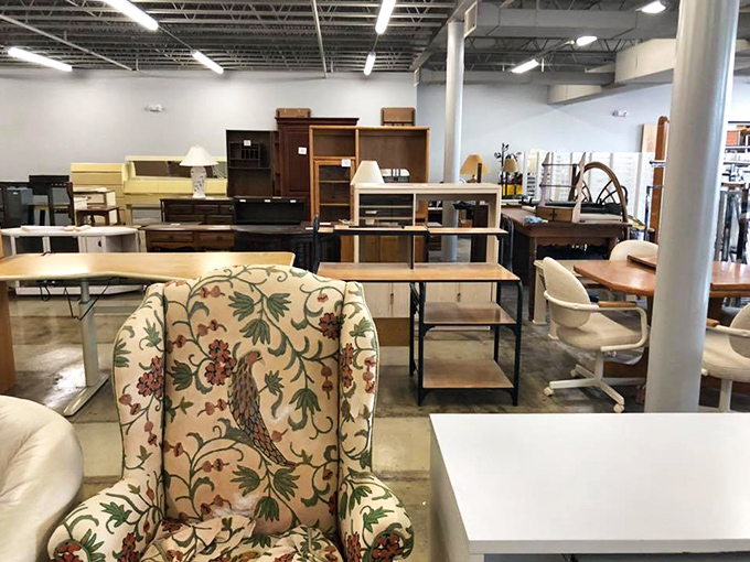 Furniture arranged like a living room showroom. One person's downsizing becomes another's perfect starter set.