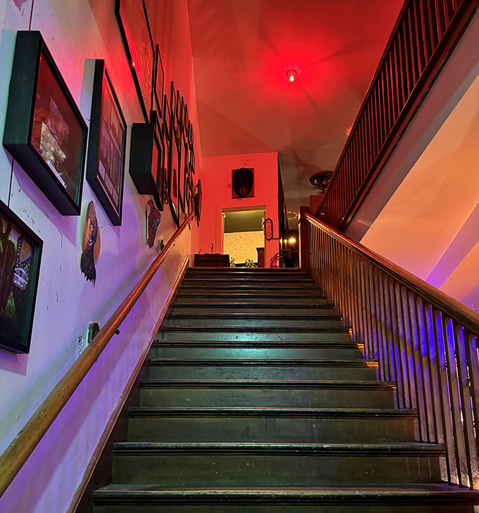 The staircase bathed in red and purple light leads visitors deeper into the museum's macabre collection&mdash;no turning back now.