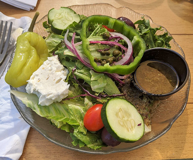 A Greek salad that actually looks like it vacationed in Athens, complete with enough feta to build a small temple.