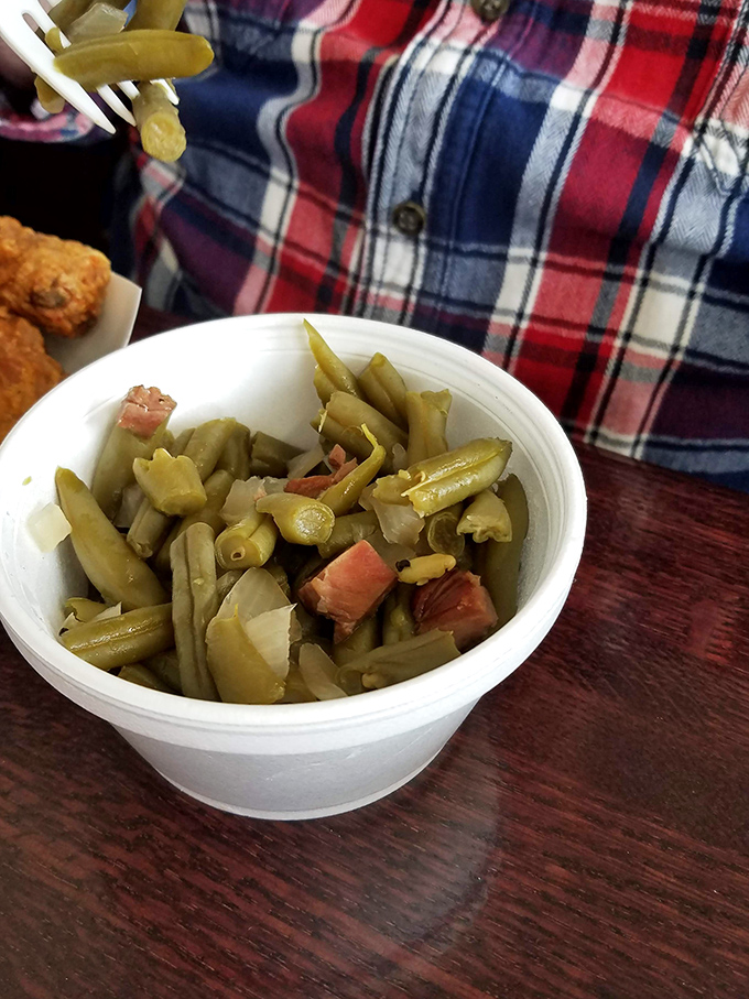 Southern-style green beans with ham hocks, cooked low and slow until they surrender all their delicious secrets to the broth.