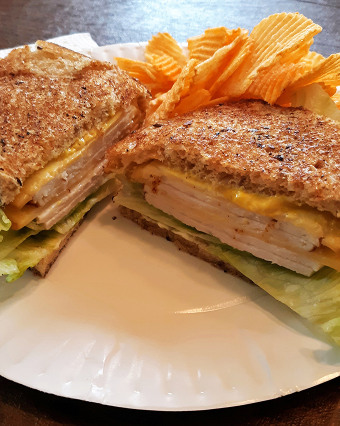 This sandwich isn't messing around&mdash;layers of turkey, cheese and veggies stacked with architectural precision and flanked by ridged chips.