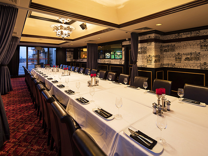 The private dining space transforms business meetings into memorable feasts—because nobody ever closed a deal over a mediocre meal.