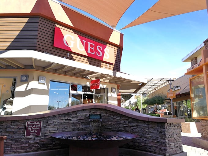 Guess welcomes shoppers with a desert water feature that whispers, "Come in for the fashion, stay because it's 110 degrees outside and we have air conditioning."