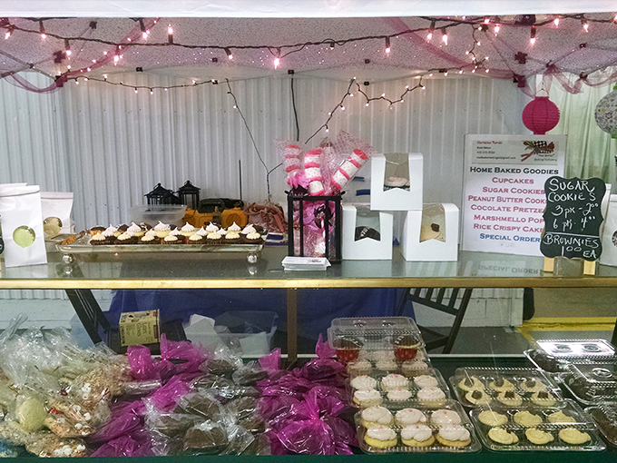 Sweet temptations under twinkling lights. This homemade bakery display proves that calories consumed at flea markets somehow don't count toward your daily total.