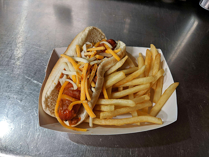The hot dog&mdash;America's humble hero&mdash;dressed simply with cheese and nestled beside golden fries. No pretension, just delicious nostalgia on a bun.