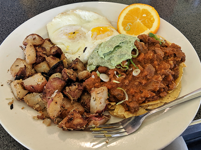 Huevos rancheros that would make abuelitas nod in approval &ndash; crispy potatoes, perfectly cooked eggs, and a generous helping of homemade salsa.