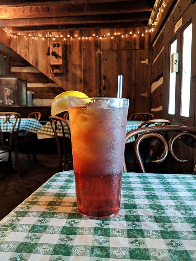 An iced tea with lemon in a rustic setting&mdash;the quintessential Midwestern refreshment that somehow tastes better against the backdrop of wooden walls and checkered tablecloths.