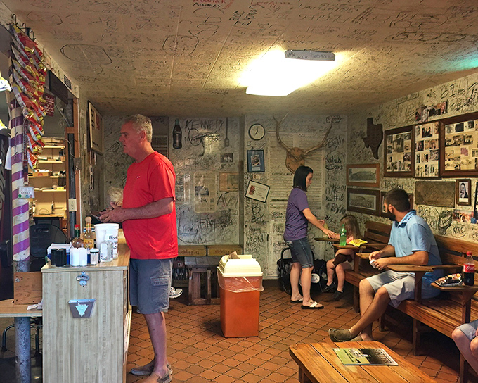 Inside Herd's, the dance of diners and staff plays out against a backdrop of wall signatures&mdash;a choreography perfected over decades of burger service.