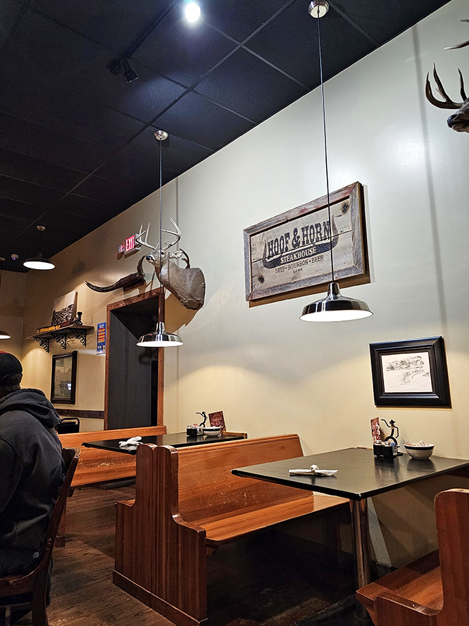 Wooden booths that have absorbed decades of laughter, business deals, and the occasional "I shouldn't have ordered the 24-ounce porterhouse" regrets. 