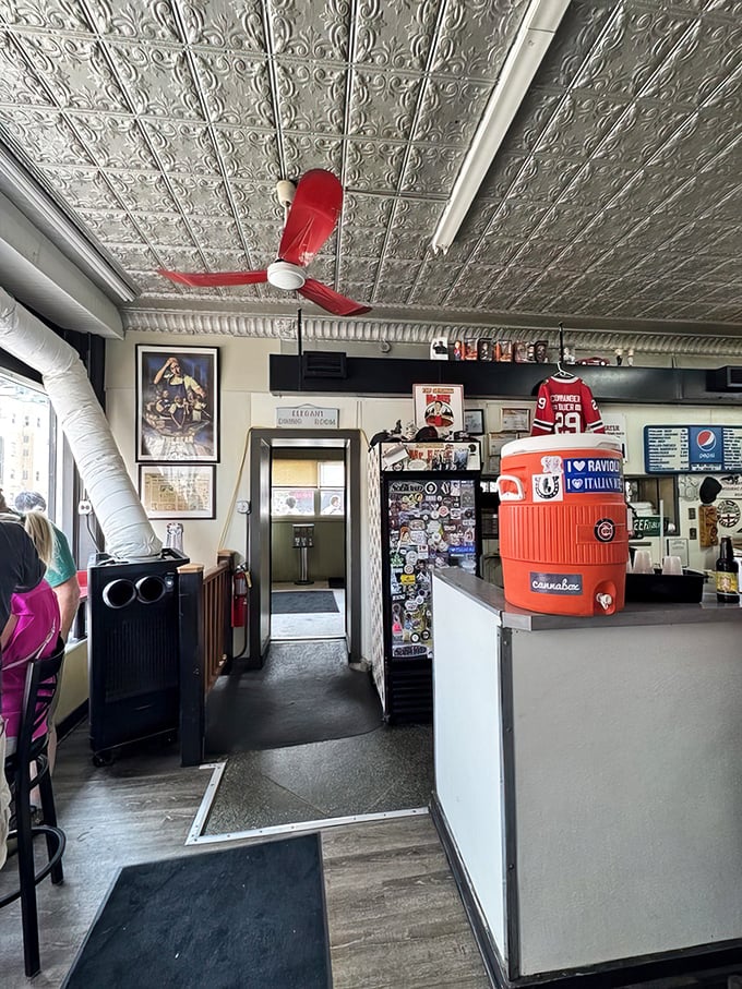 The red ceiling fan spins above decades of Chicago food history. If these walls could talk, they'd probably just say "dipped, hot."