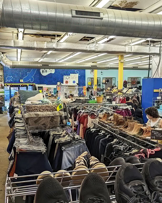 The wide-angle view reveals the true scale of this thrifter's paradise&mdash;racks upon racks of possibilities under exposed ductwork and bright lights.