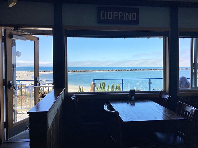 Another angle reveals Sam's welcoming interior where comfort food meets spectacular ocean views through every window.