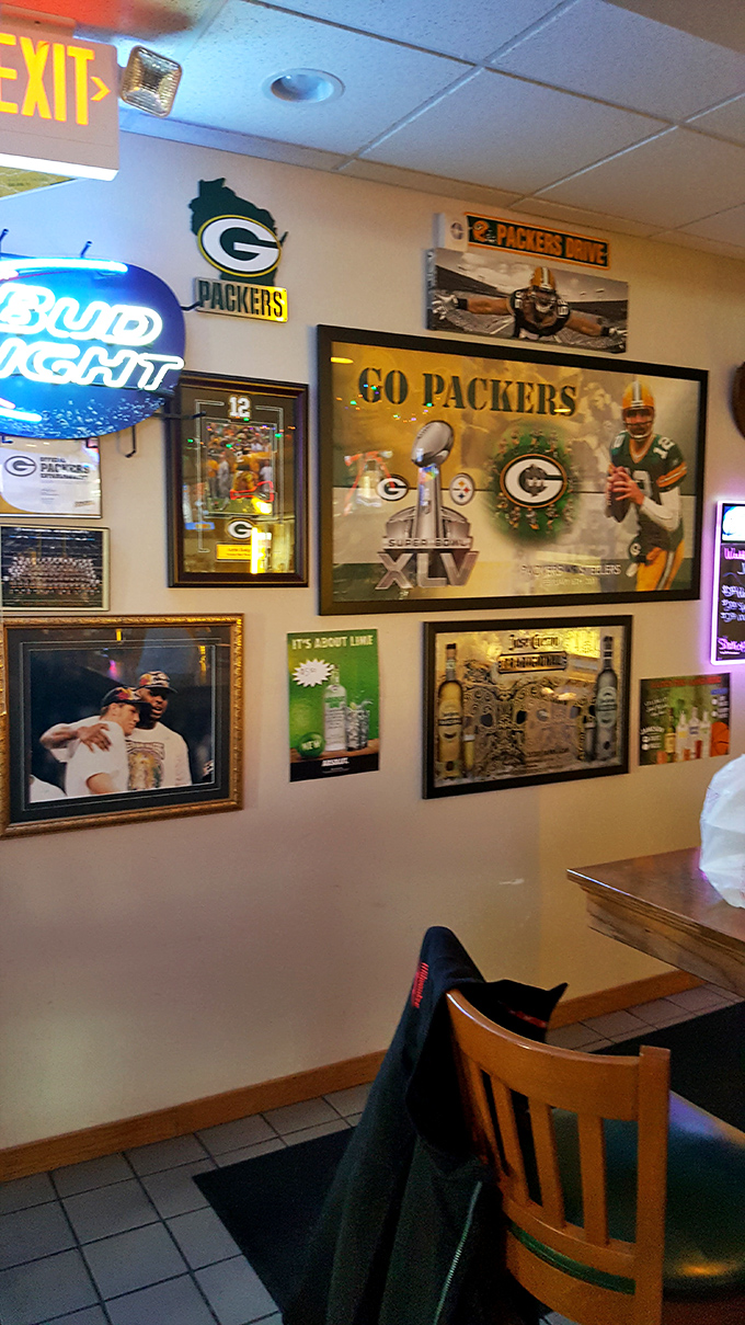 The wall of Packers memorabilia serves as both decoration and Wisconsin citizenship test &ndash; true locals can name every player pictured.