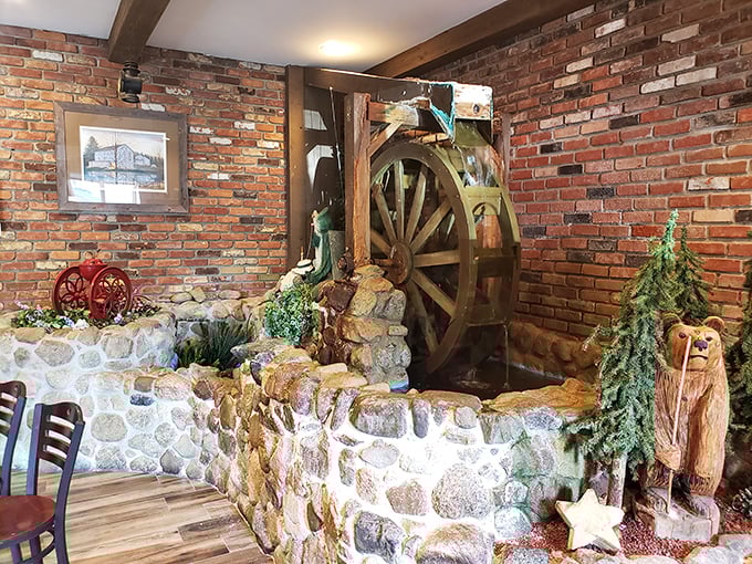A whimsical water wheel and stone wall create a slice of country charm inside&mdash;dining ambiance that transports you to simpler times.
