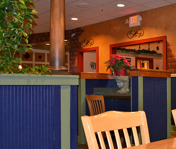 Blue wainscoting and warm lighting create that "everybody knows your name" vibe that keeps locals coming back for more.