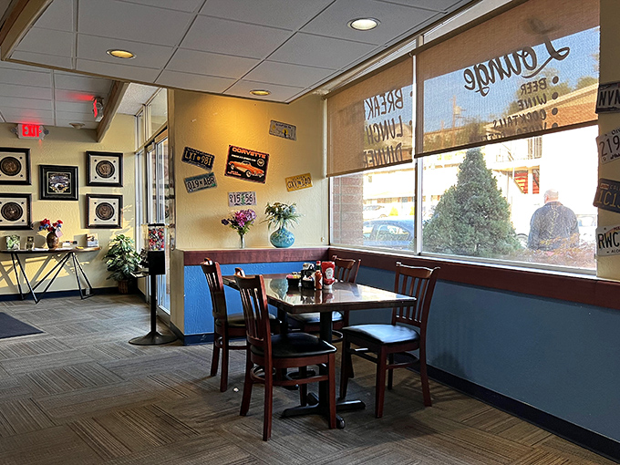 Corner booths: the real estate everyone secretly covets. Blue wainscoting and warm lighting create that "stay awhile" vibe that turns meals into memories.
