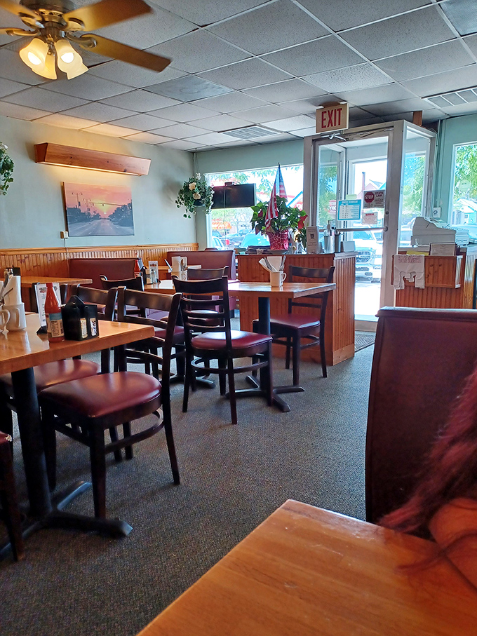 Morning light streams through windows, illuminating empty tables that won't stay that way for long. The calm before the breakfast storm.